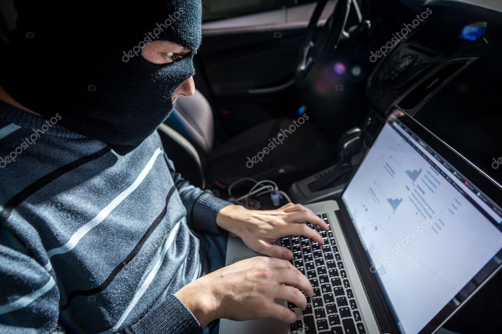 Hacker with a laptop inside a car — Stock Photo © agnormark.gmail.com ...