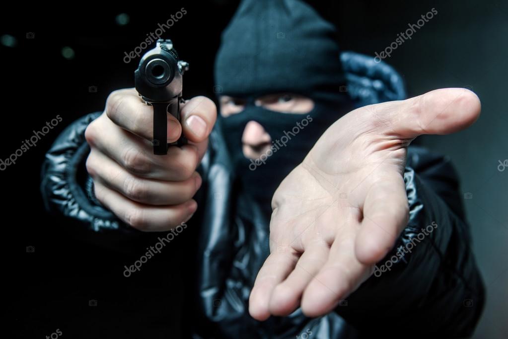Robber with an aming gun — Stock Photo © agnormark.gmail.com #100270662
