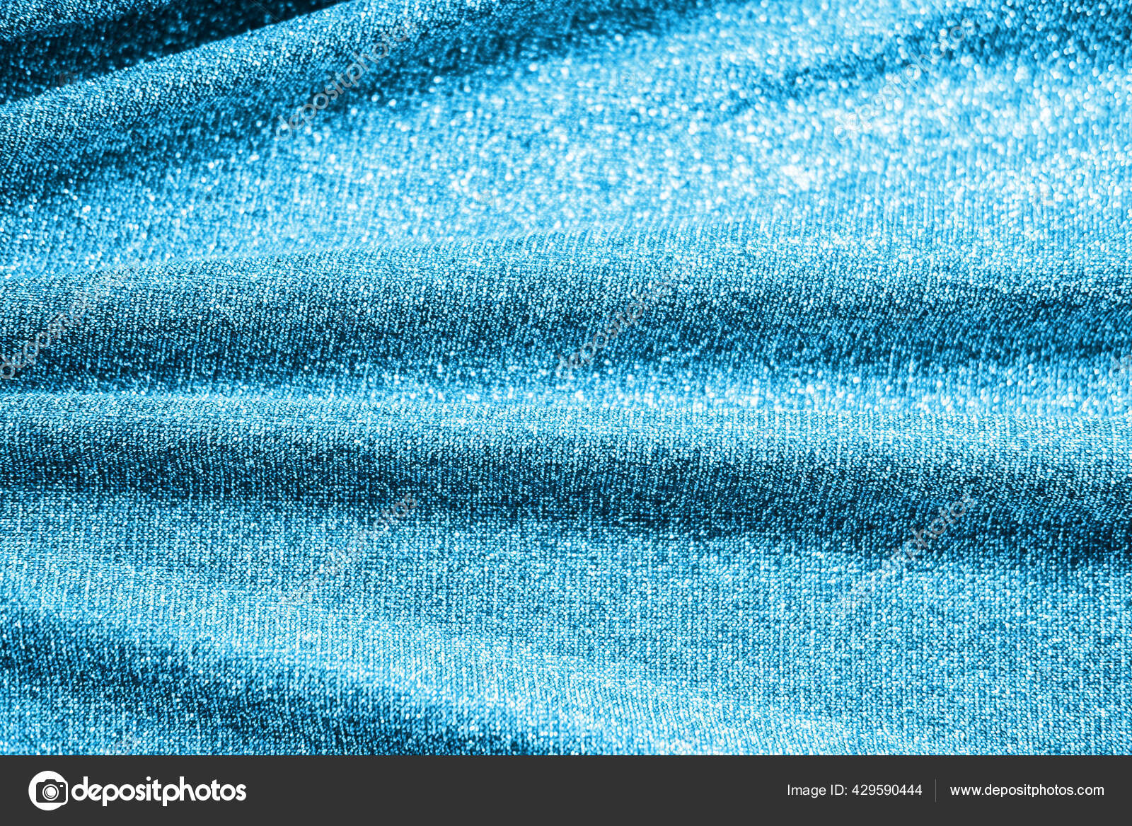 Colored blue shiny fabric texture with folds. Surface background colors ...