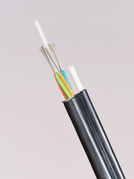 Green Nylon coated fiber optic cable with stripped and exposed fibers ...