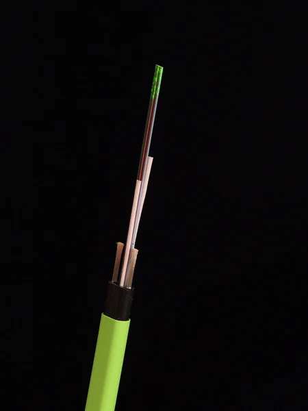 Green Nylon coated fiber optic cable with stripped and exposed fibers ...