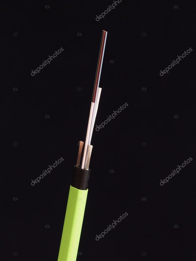 Green Nylon coated fiber optic cable with stripped and exposed fibers ...