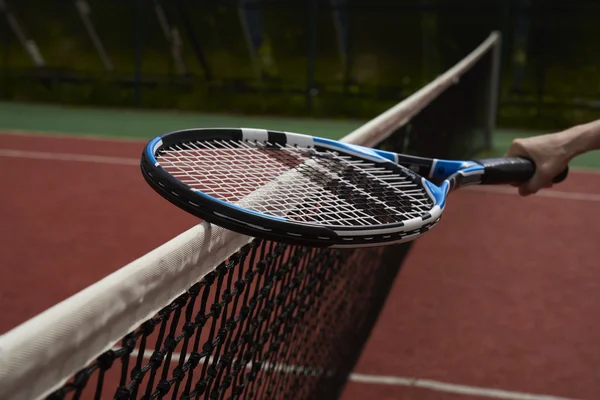 Tennis racket with broken strings. Stock Photo by ©luckyraccoon 299222728