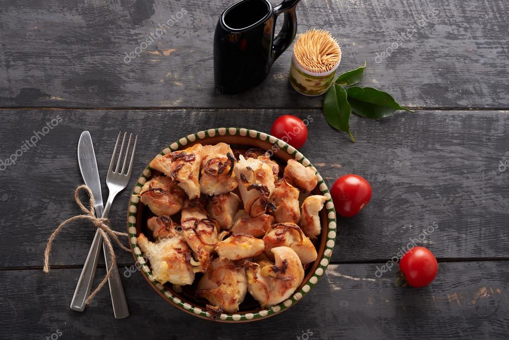 Chicken a barbecue on a wooden table in a restaurant — Stock Photo © r ...