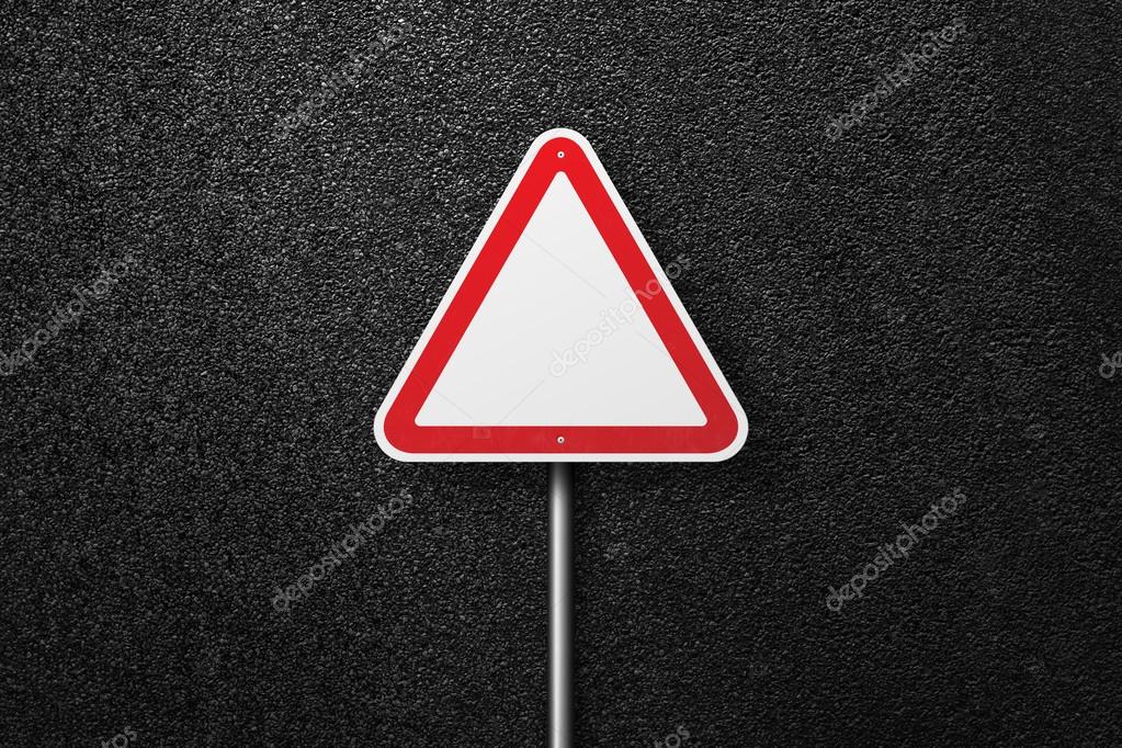 Road signs of the triangular shape on a background of asphalt. The ...