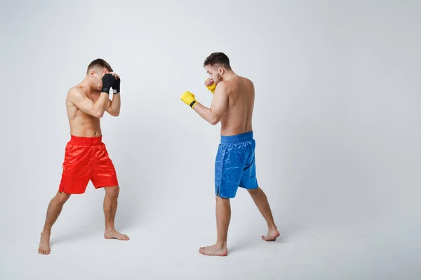 Two men boxers fighting muay thai kickboxing white background — Stock ...