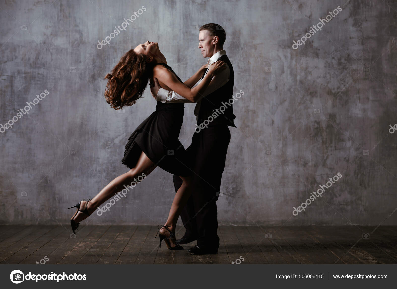 Man and woman in black dress dance tango in studio — Stock Photo © atercorv.gmail.com #506006410