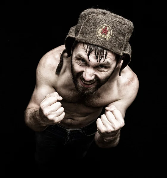 Dark portrait of scary evil sinister bearded man with smirk, makes ...