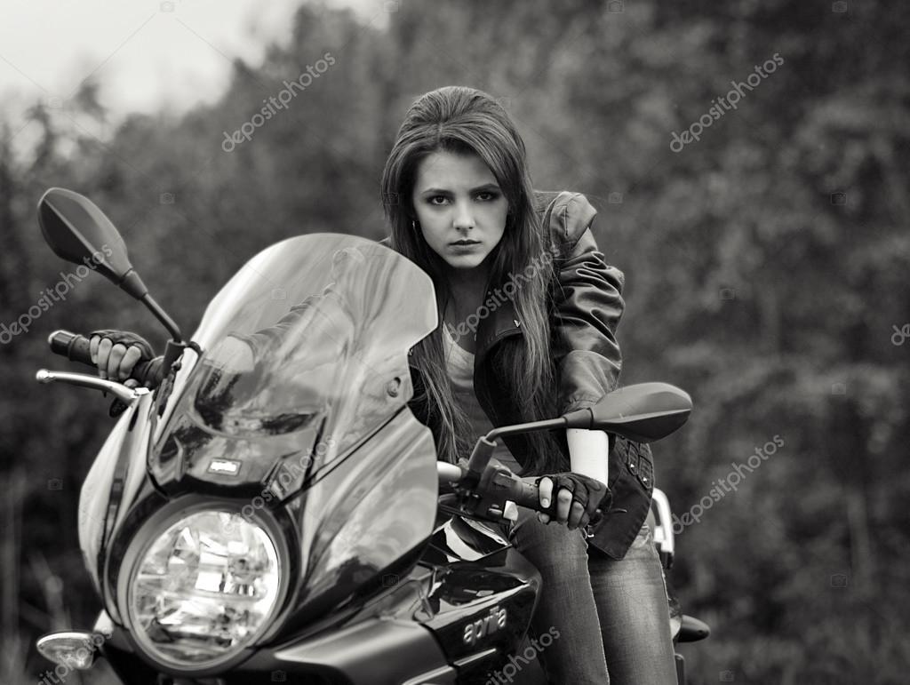 Biker with dangerous look with a speed motorbike,bike.Serious ...