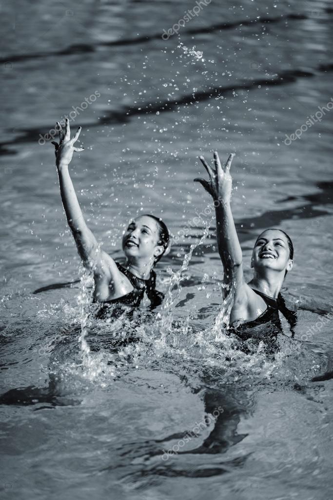 Synchronized Swimmers dance — Stock Photo © microgen #115182716 Synchronized Swimmers dance — Stock Photo © microgen #115182716