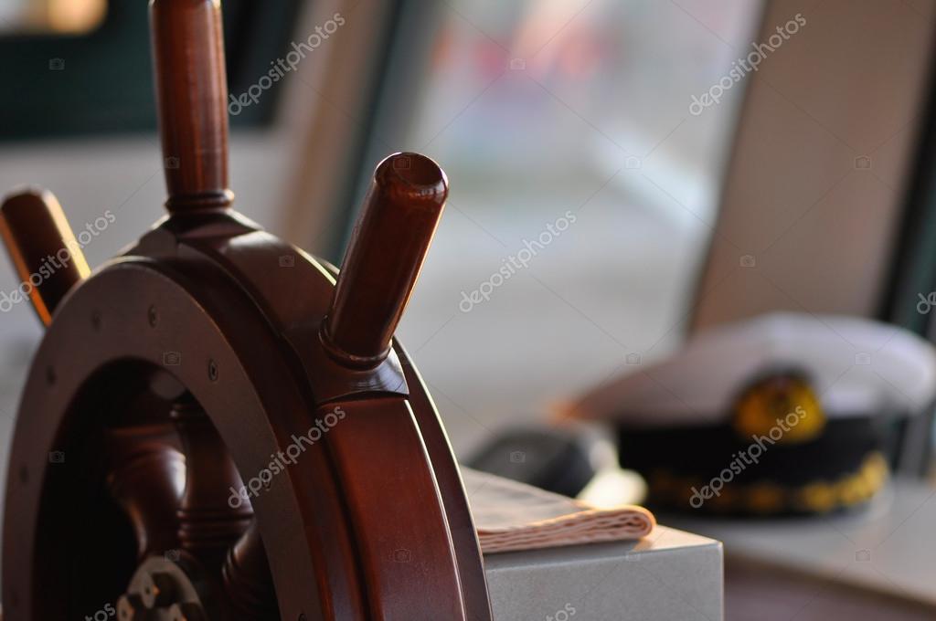 Helm and captains cap Stock Photo by ©microgen 115191232
