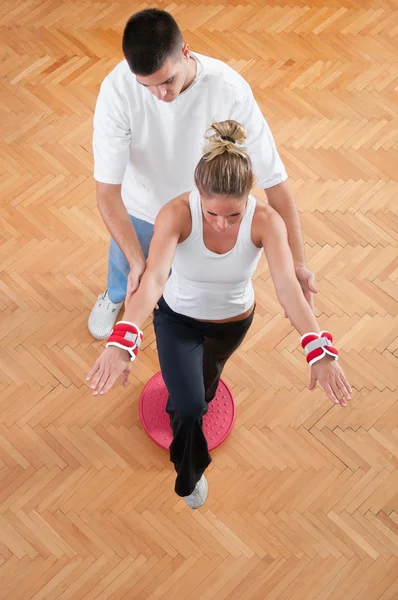 athlete working with balancing plate - Stock Image - Everypixel