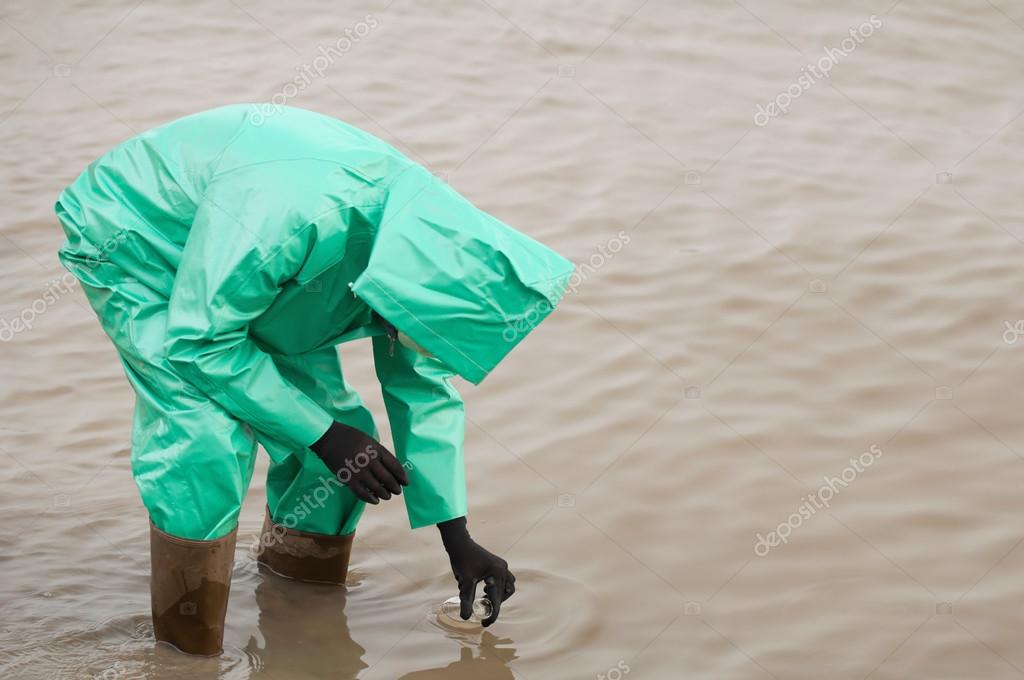 Male Environmentalist sampling polluted water Stock Photo by ©microgen ...