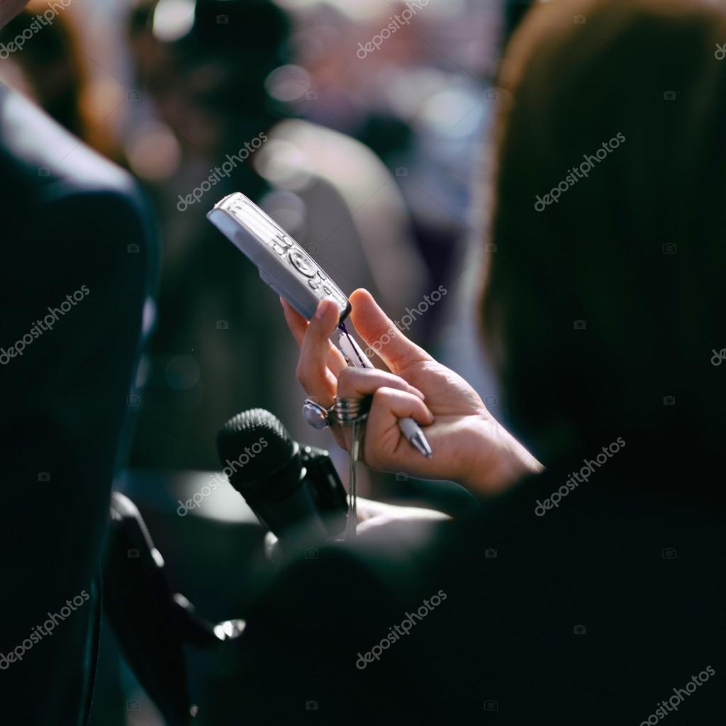 Journalist with voice recorder — Stock Photo © microgen #115436062