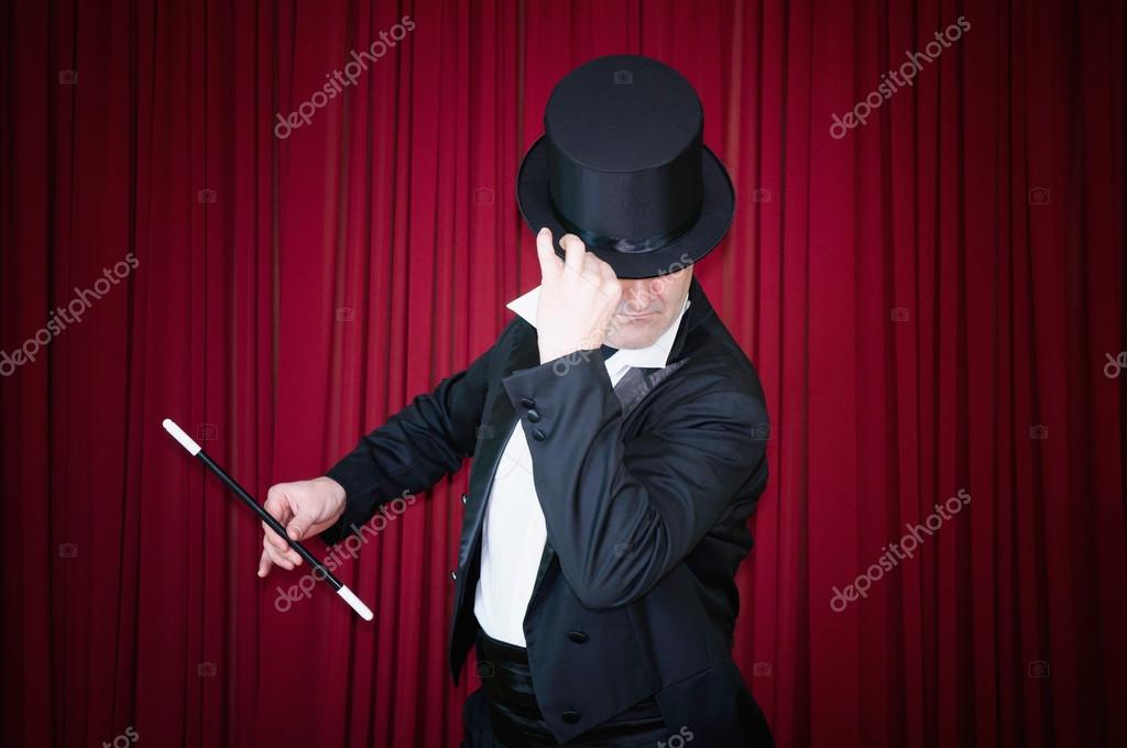 Magician performing on stage Stock Photo by ©microgen 115467958