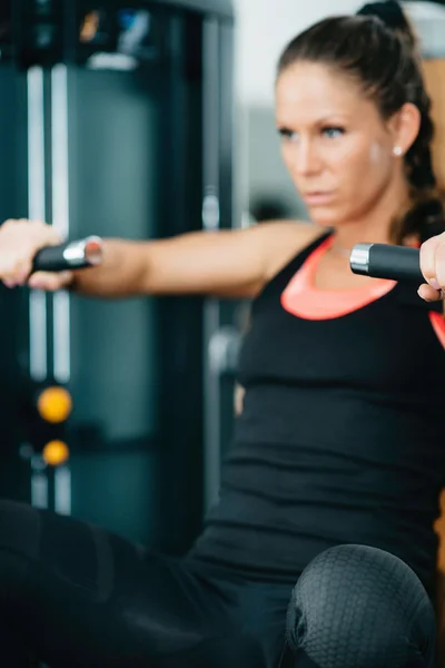 Female athlete exercising on chest press - Stock Image - Everypixel