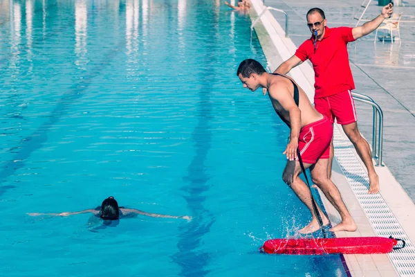 Lifeguard jumping to rescue — Stock Photo © microgen #115616436