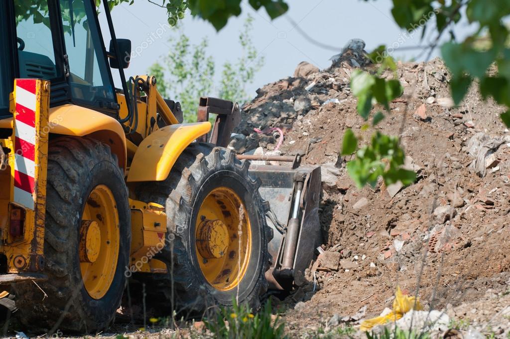 Front end loader on construction site Stock Photo by ©microgen 115773010