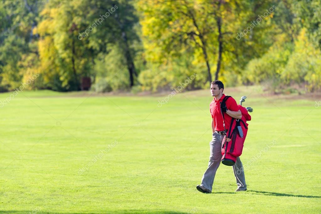 Golfer on golf course Stock Photo by ©microgen 116036818