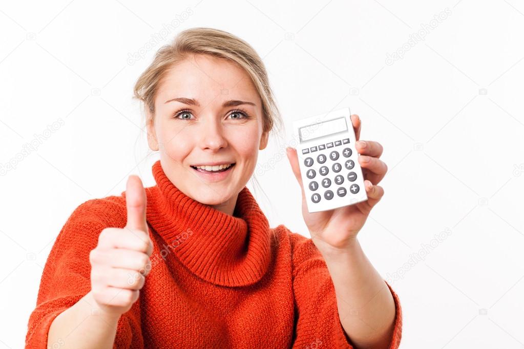 Thrilled young blond woman with calculator and thumbs up — Stock Photo ...