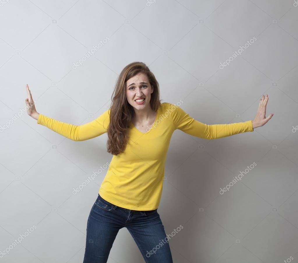 Pushing away hand gesture for angry beautiful young woman Stock Photo ...
