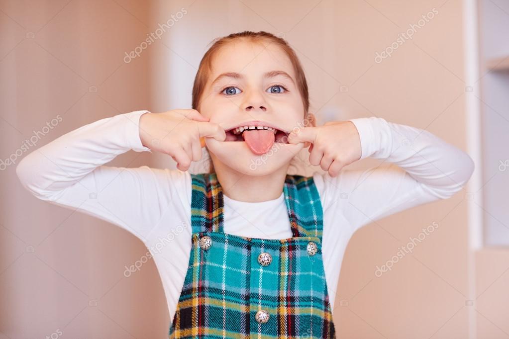 Girl pulling face — Stock Photo © mavoimages #106189240