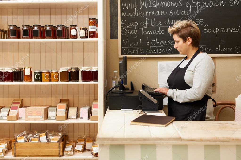 Deli worker standing behind counter — Stock Photo © mavoimages #106204270