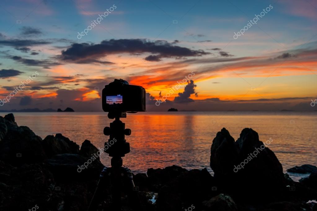 The camera standing on the beach of a tropical island and photographed ...