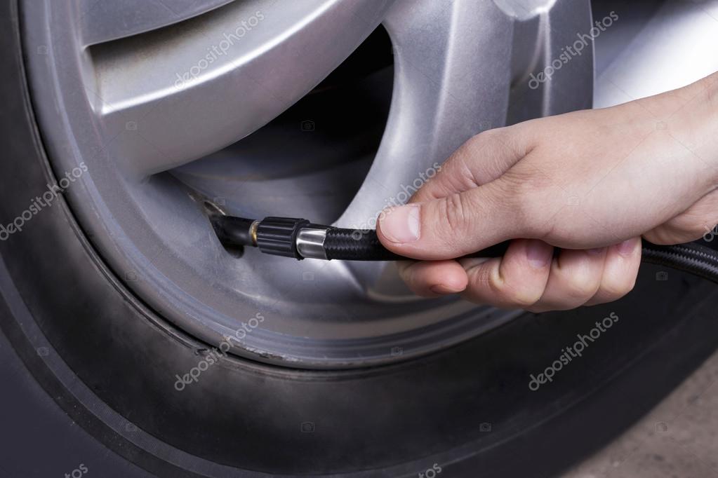 Inflating the wheels Stock Photo by ©DevidDO 118132616