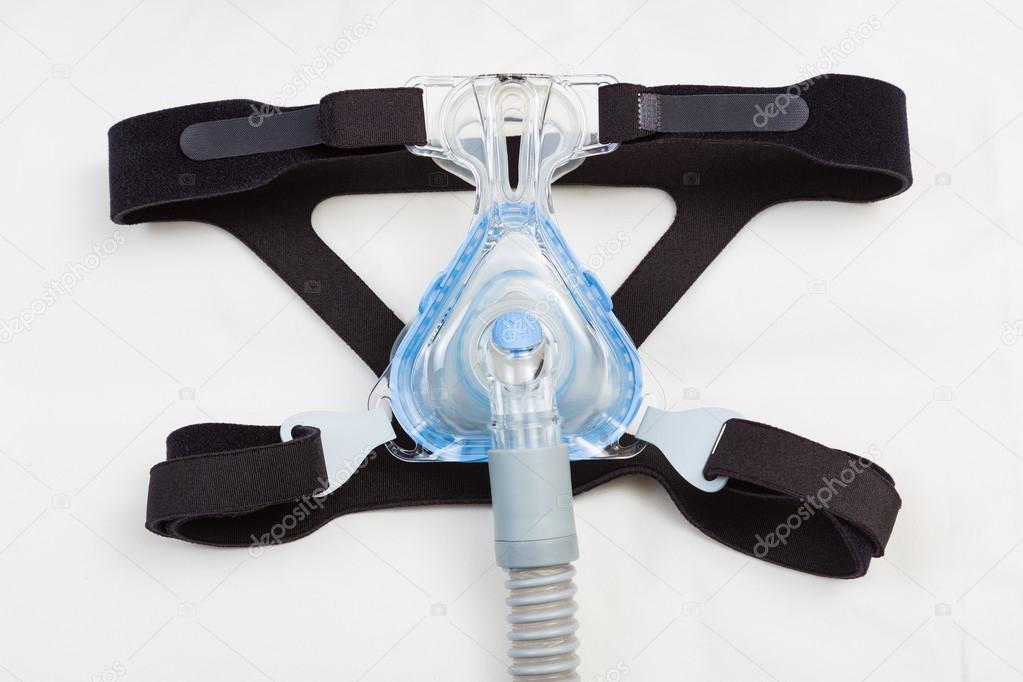 Sleep apnea headgear mask and hose Stock Photo by ©cpoungpeth 114575714