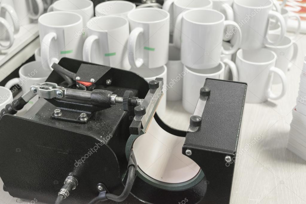 Sublimation printing equipment and mugs — Stock Photo © Mixa75 #112197698