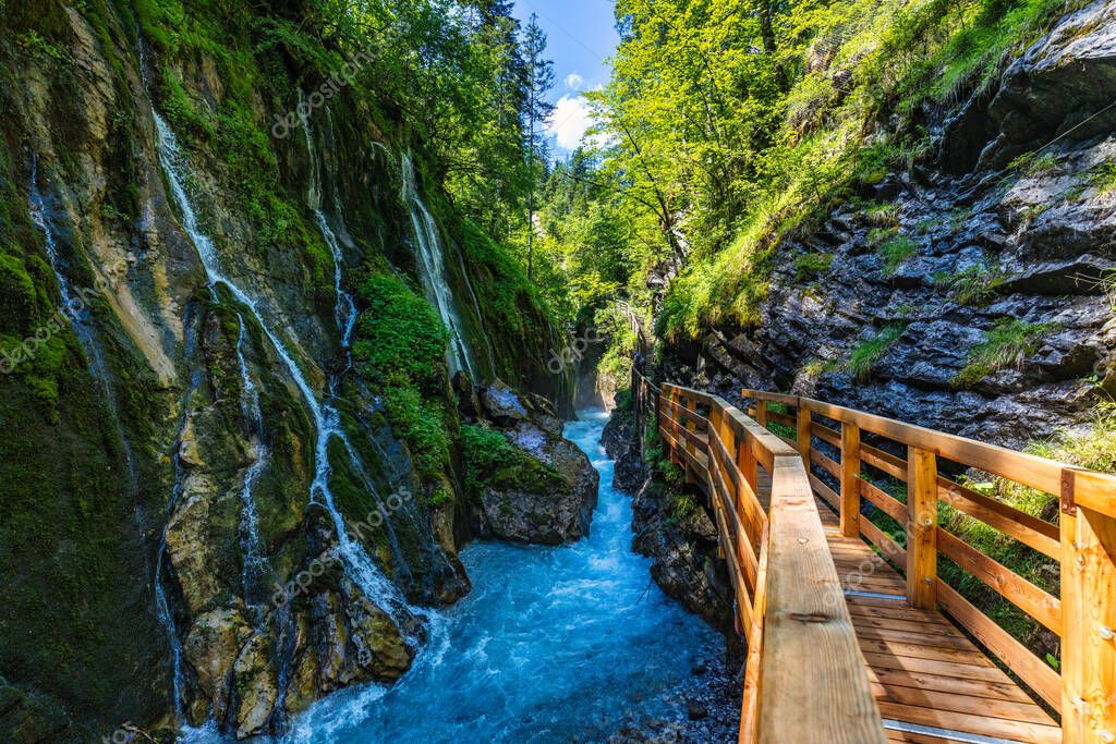 Beautiful Wimbachklamm gorge with wooden path in autumn colors, Ramsau ...