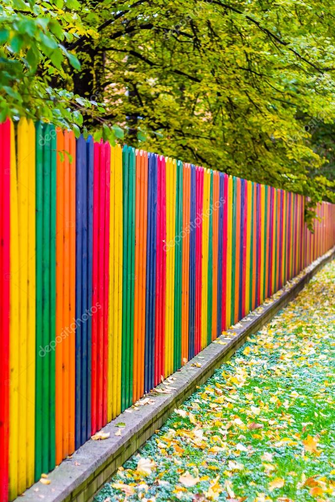 Multi colored rainbow wooden fence in autumn Stock Photo by ©DaLiu 95748052