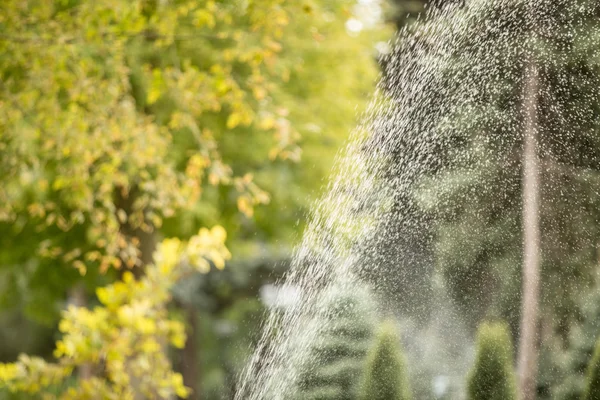 Garden sprinklers splashing water — Stock Photo © Scharfsinn #112091778