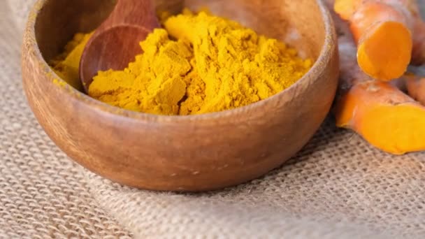 Turmeric Powder and roots, curcuma longa, kurkuma. panning turmeric on ...