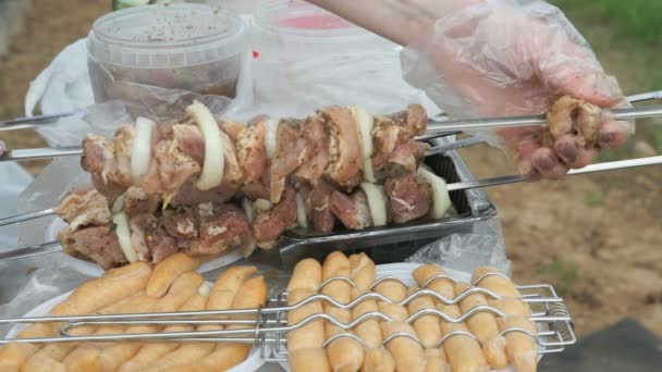 Hand is stringing pieces of raw meat on a skewer — Stock Video ...