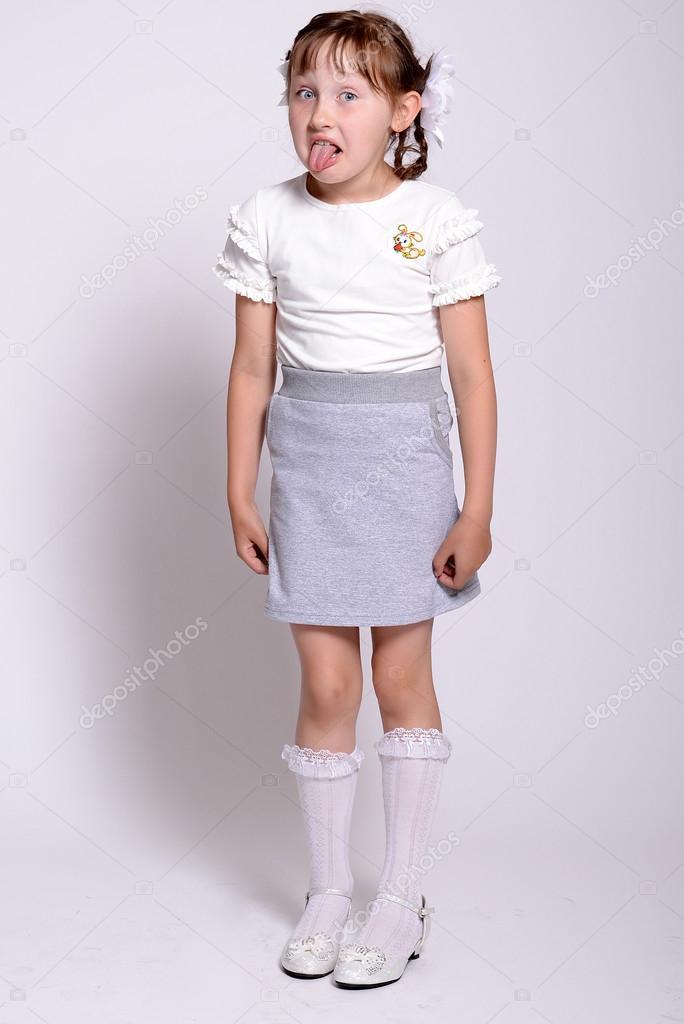 Young schoolgirl.Isolated studio portrait — Stock Photo © lexxxx37Reg ...