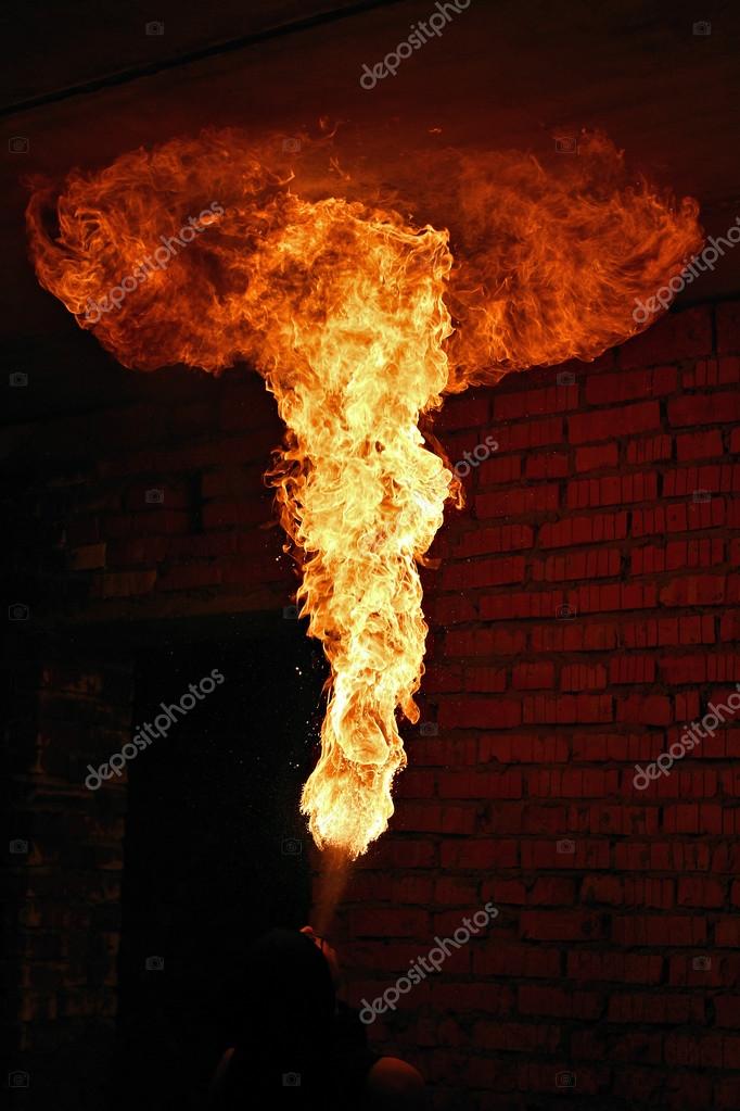 Fire artist performing fire breathing Stock Photo by ©Abraksis 101465236