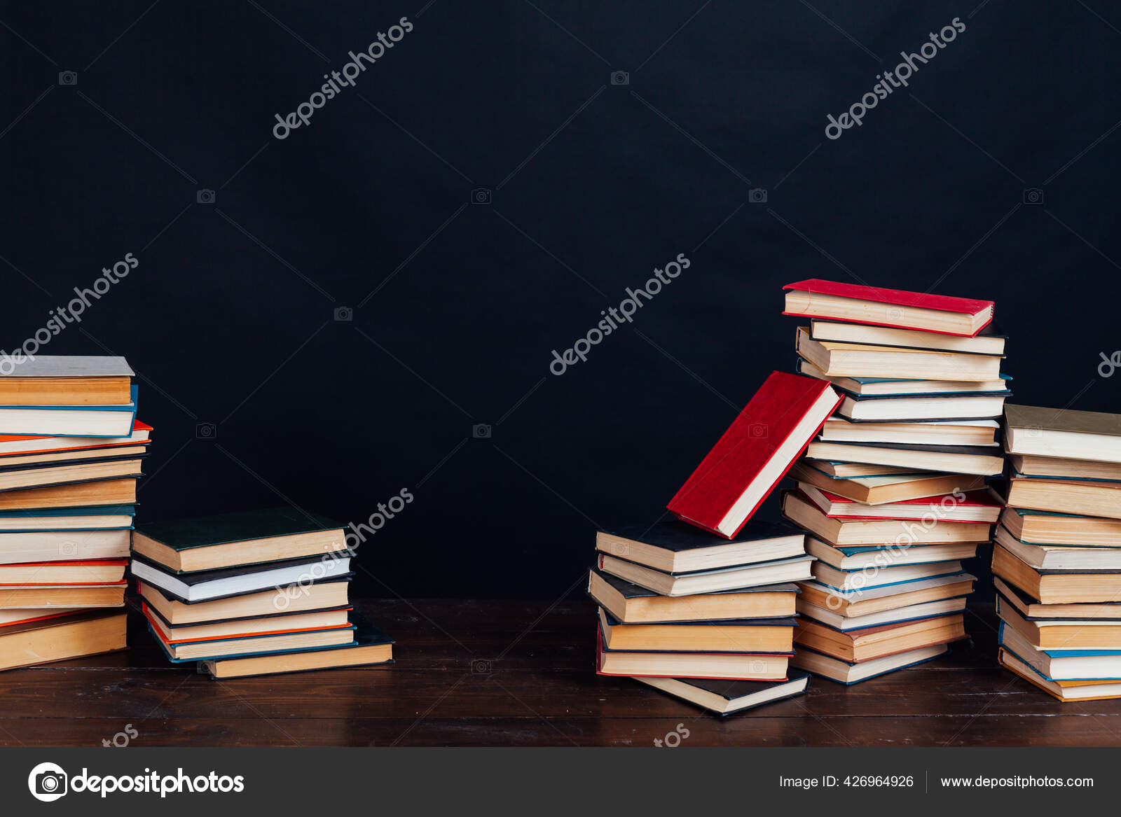 Many stacks of educational books to study in the university library as ...
