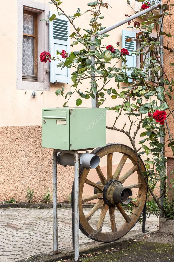 Mailbox with wheel and flowers Stock Photo by ©hzparisien@gmail.com ...