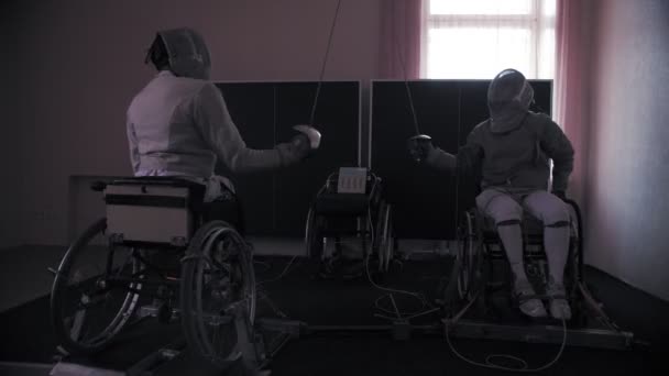 Disabled athlete. fencing. white fencing uniformed fencers, in ...