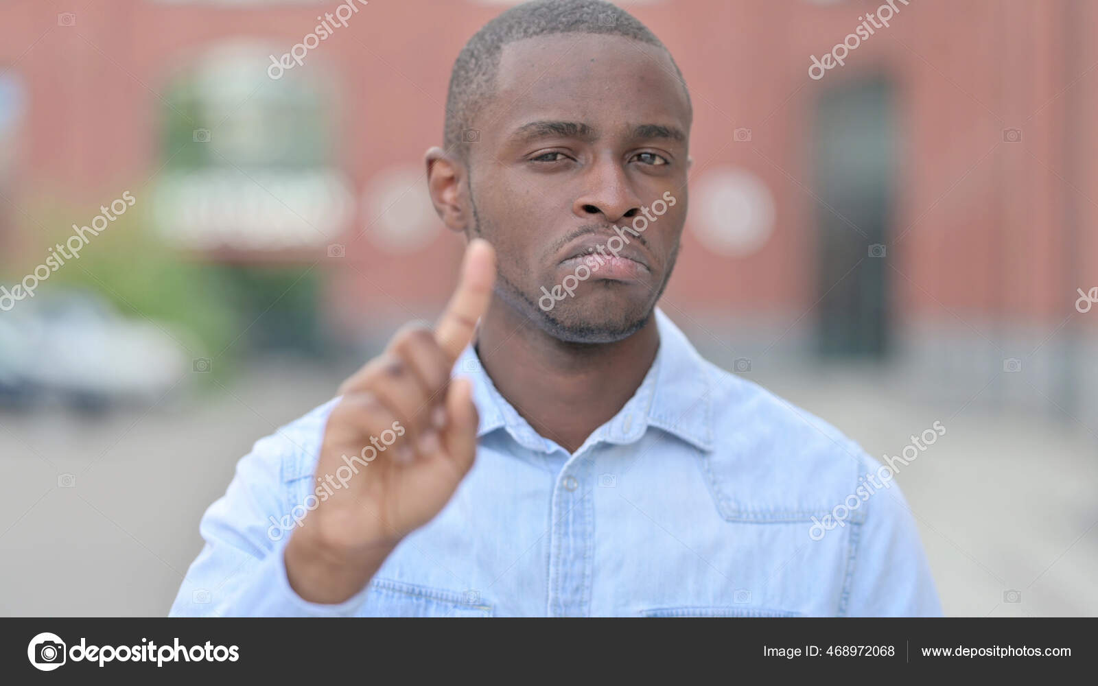 Portrait of Young African Man saying No with Finger Sign — Stock Photo © ramerocrist.gmail.com ...