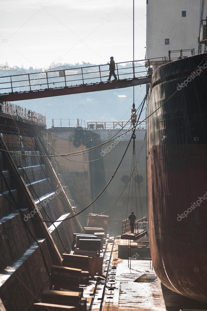 Shipyard workers in dry dock. Stock Photo by ©antonpedko.gmail.com ...