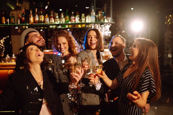 Confetti party. Have fun together. Group of happy people throwing ...