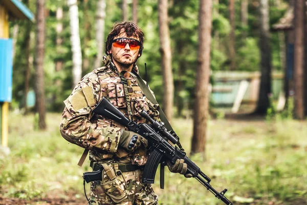 Armed man in a zone of armed conflic - Stock Image - Everypixel