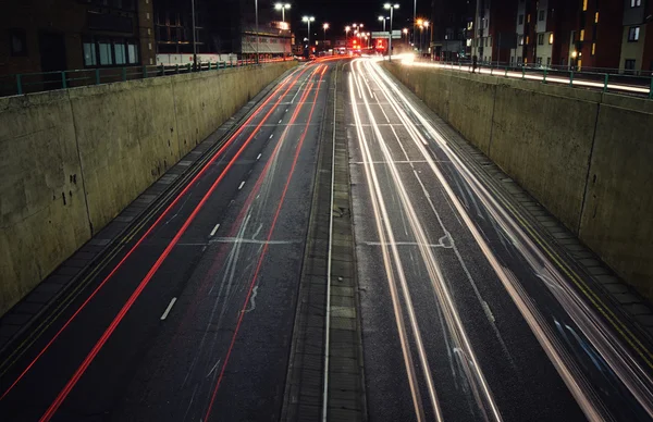 Long time exposure freeway cruising car light trails streaks of light ...