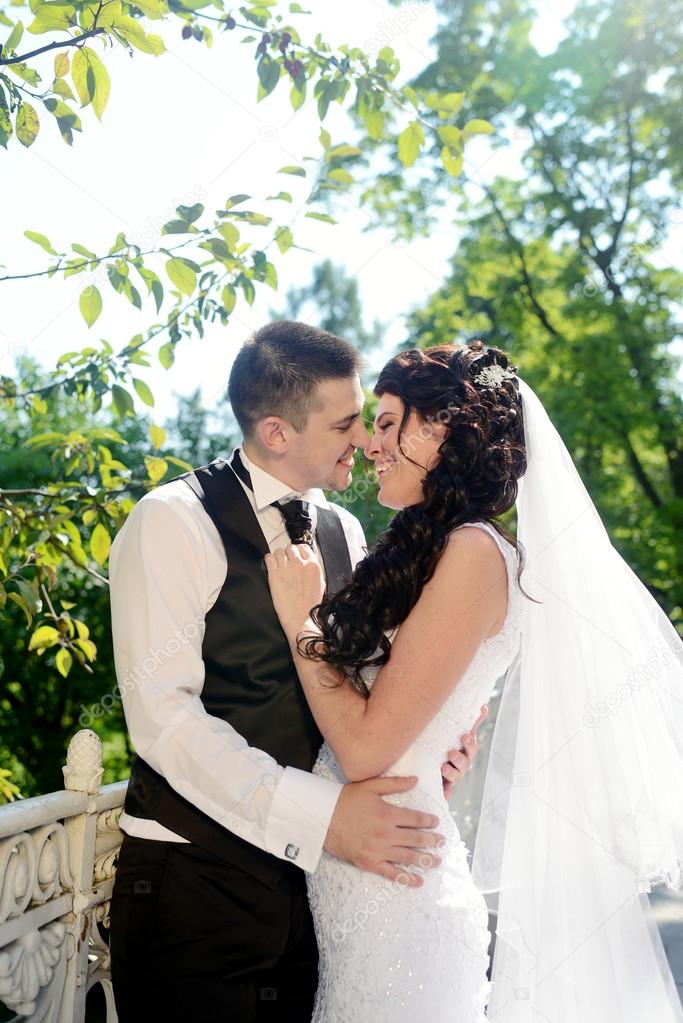 Wedding couple hugging in park — Stock Photo © pvstory #104842048