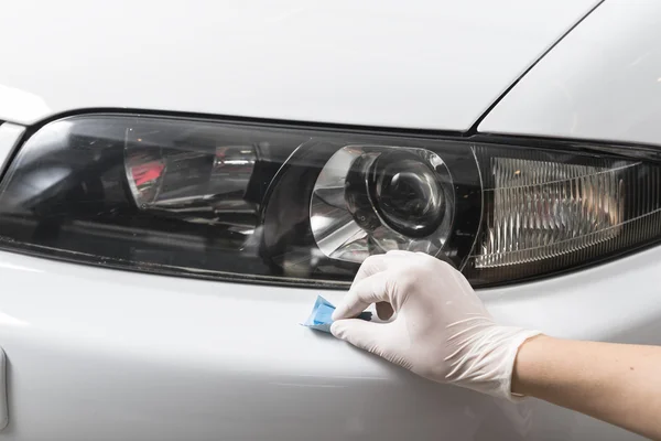 Car detailing series: Closeup of hand coating black car paint Stock ...