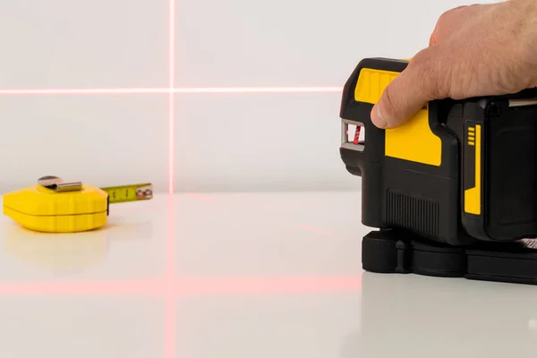 Specialist Makes Measurements Using Electronic Laser Measuring Angles ...