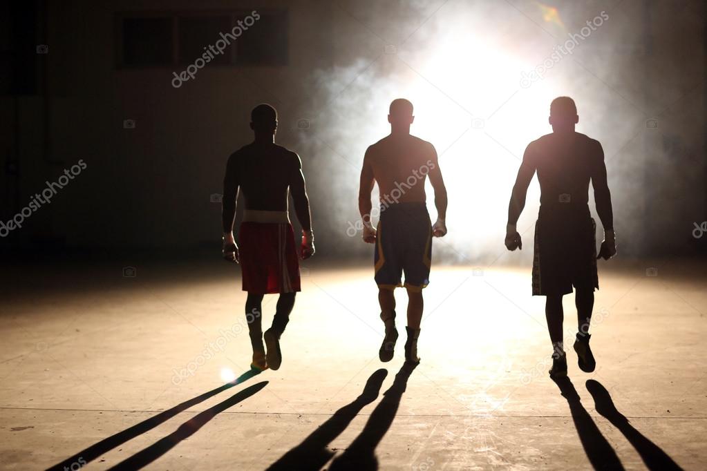 Three young men boxing workout in an old building Stock Photo by ...
